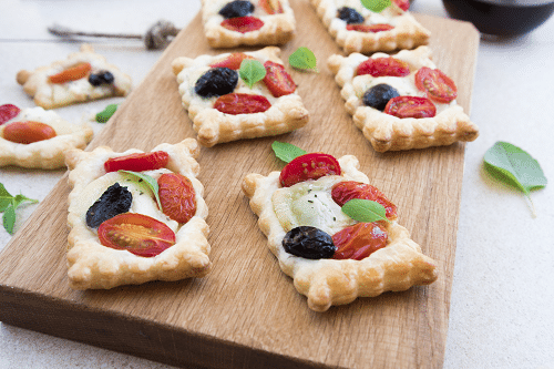 Flaky pastry, Pico cheese, olive and cherry tomato appetisers - Germain